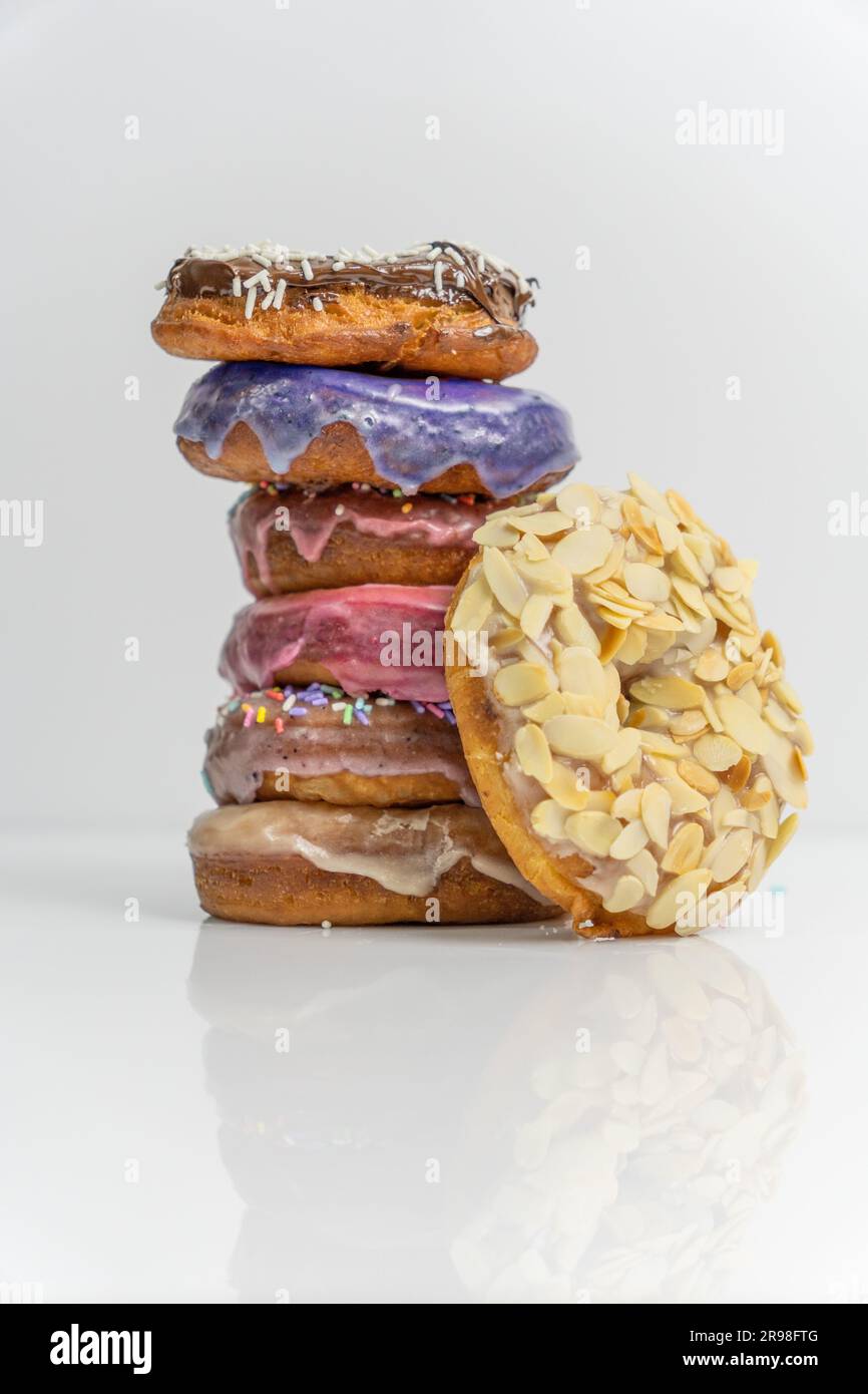 A selection of freshly-made doughnuts with a variety of colorful ...