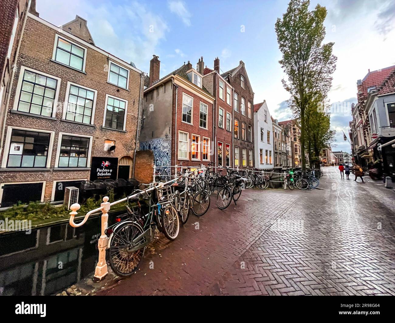 Delft, The Netherlands - October 5, 2021: Street view and a scene from the canals in Delft, a ...