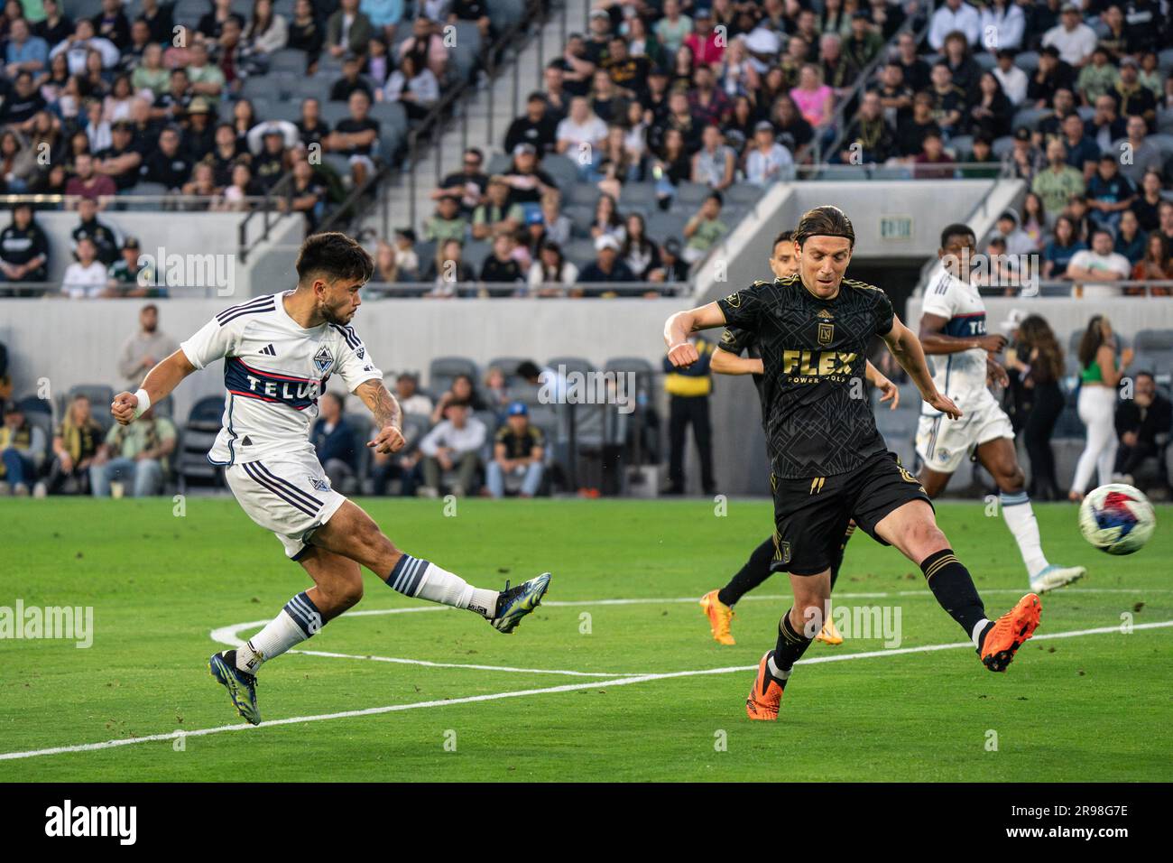 Vancouver Whitecaps midfielder Ryan Raposo (27) attempts a shot against LAFC midfielder Ilie ...