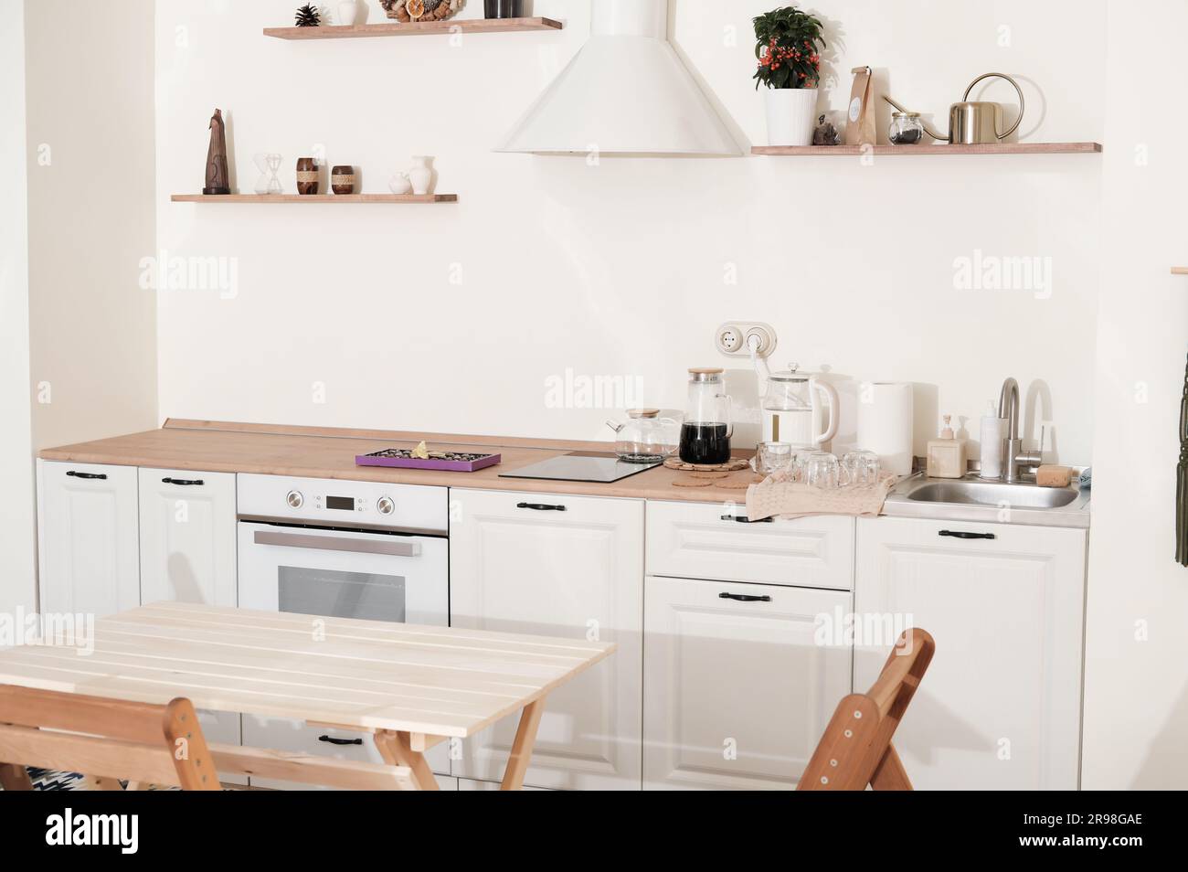 modern kitchen interior in apartment. trendy minimal style furniture ...