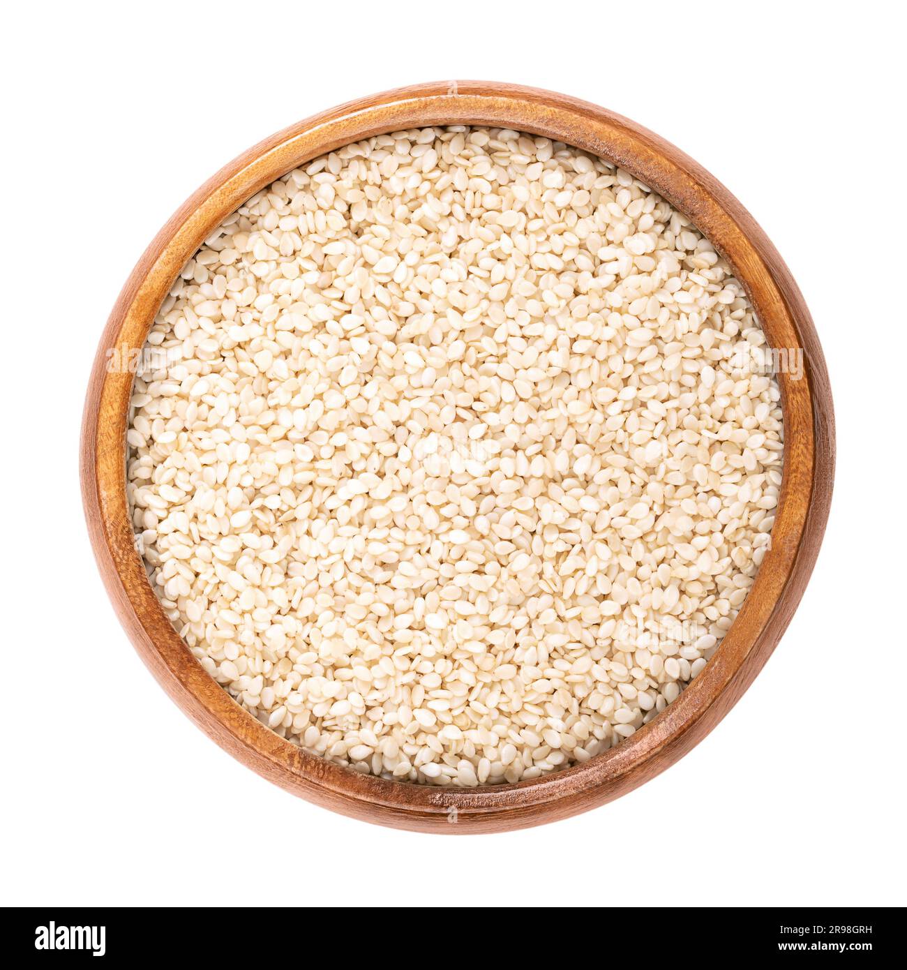 Hulled sesame seeds, white sesame in a wooden bowl. Sesamum indicum ...