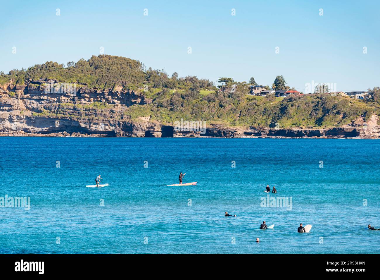 Surfboard riders at Mona Vale Beach in Sydney, New South Wales ...