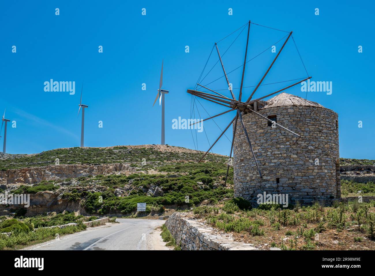 Wind farm and old windmill near Koronos village on Naxos island. Greece ...