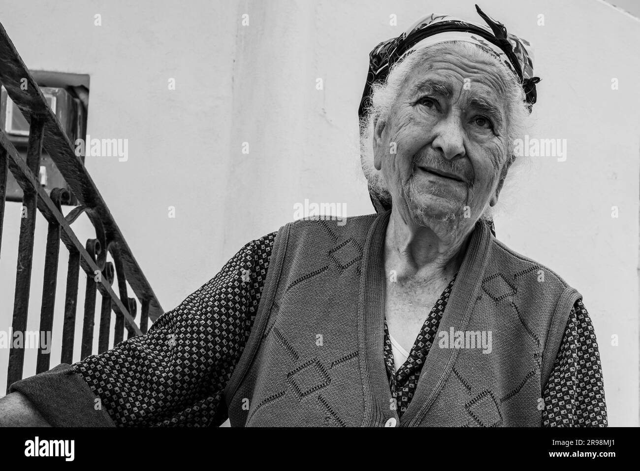 Portrait of an old Greek lady, wearing a scarf. Naxos, Greece. Black ...