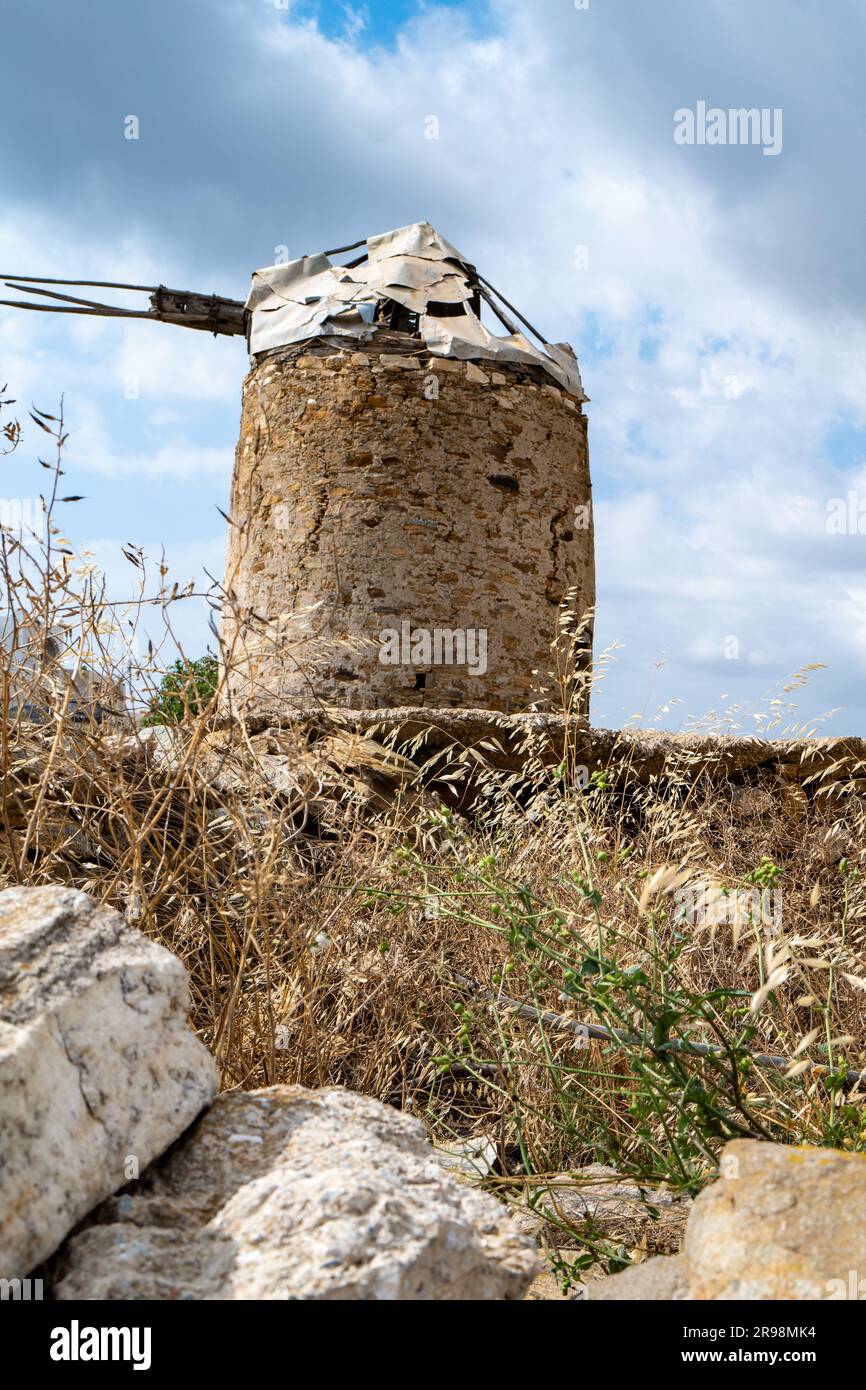 A derelict windmill on the Greek Island of Naxos with blue sky Stock ...