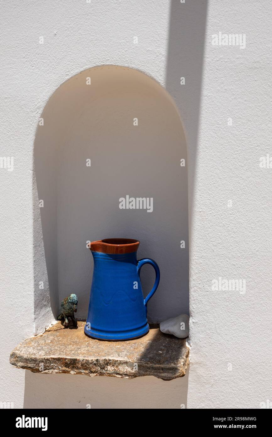 Greek terracotta blue vase set in an alcove of a traditional ...