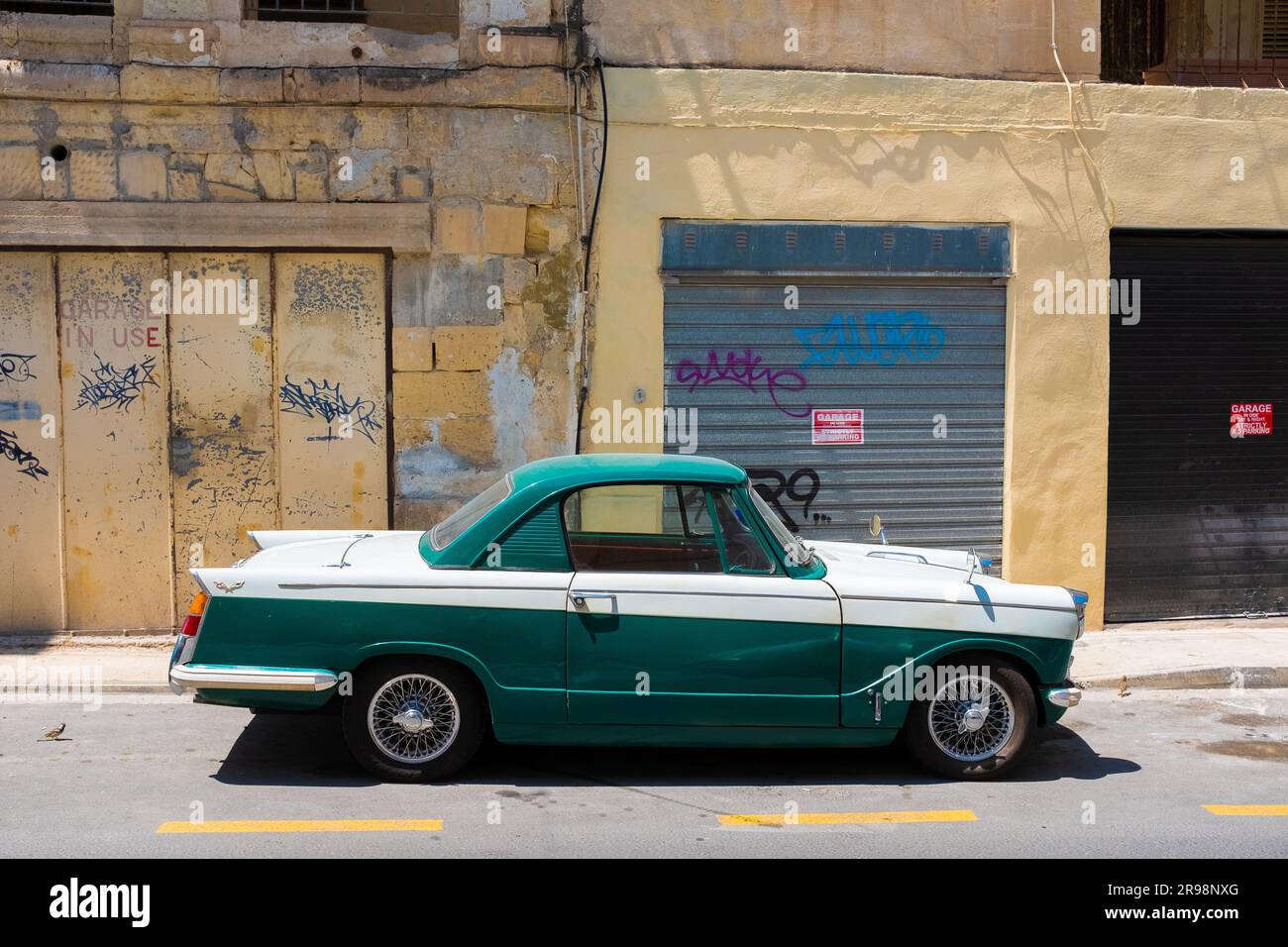 A Triumph Herald classic car parked up in a side street in Malta Stock ...