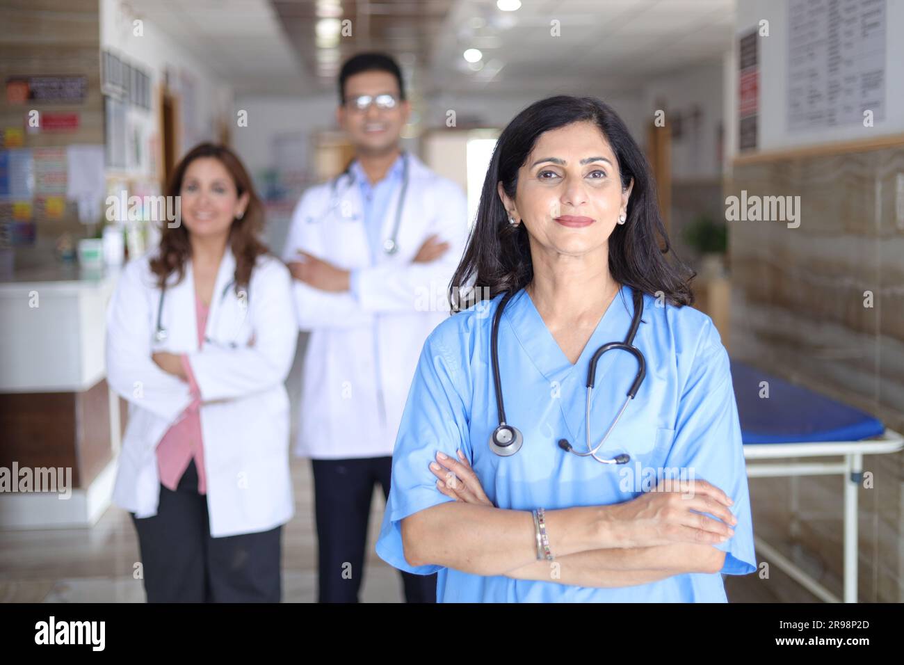 Portrait of Happy Indian Medical Team Standing In Hospital Corridor. Portrait Of Multicultural ...