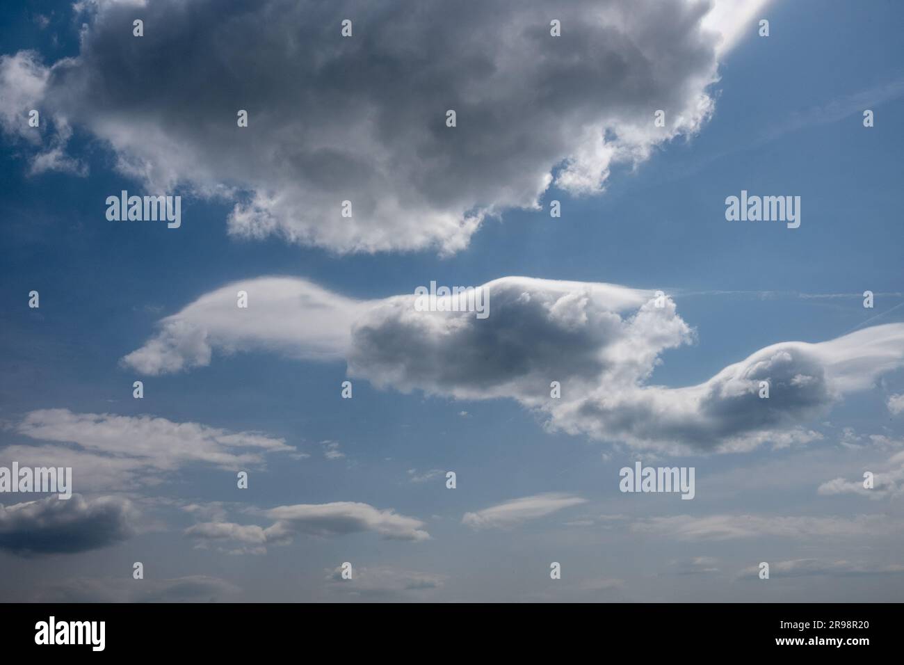 Puffy clouds in blue hi-res stock photography and images - Alamy