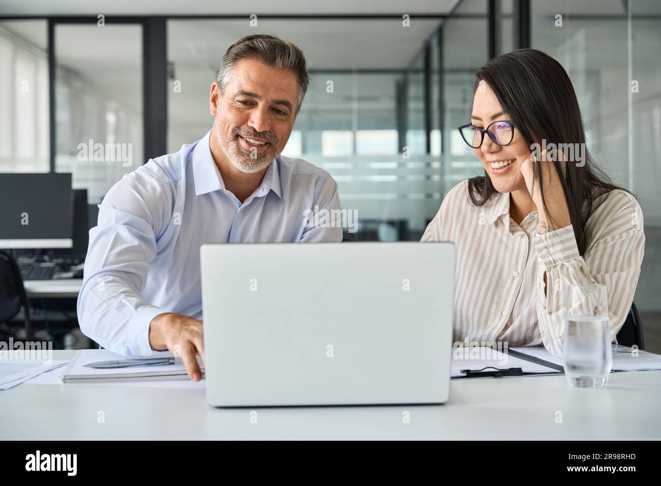 Diverse coworkers collaborating using hi-res stock photography and ...