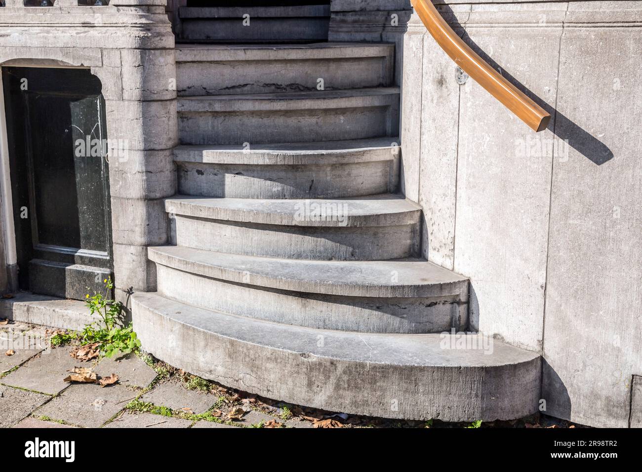 Round and curved stone steps at the entrance of a Dutch residential ...