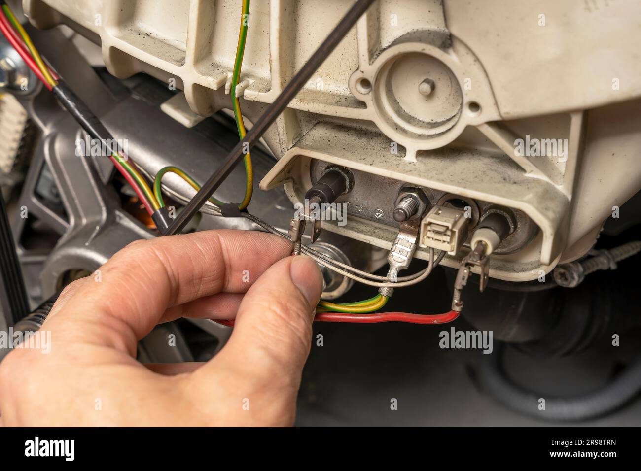 The master of the washing machine repair. Heating element for water ...