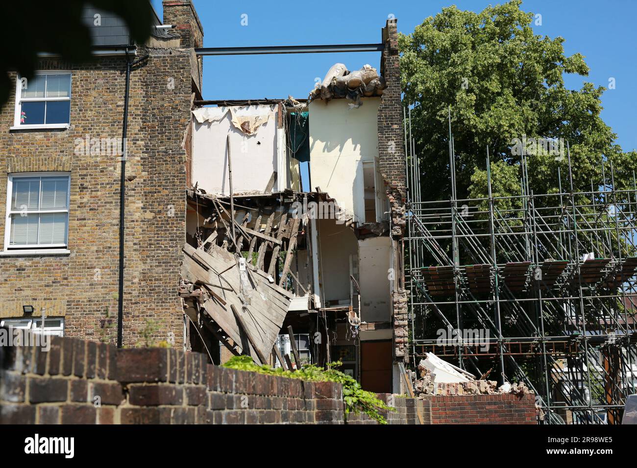 London, UK. 25 June 2023. A three-story house partially collapsed on ...