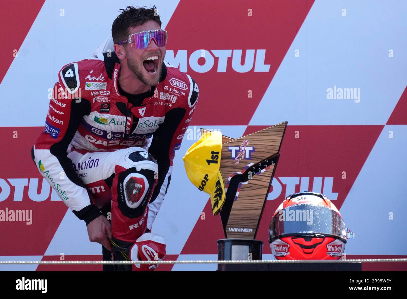 Britain's rider Jake Dixon celebrates after winning the Moto2 race at ...