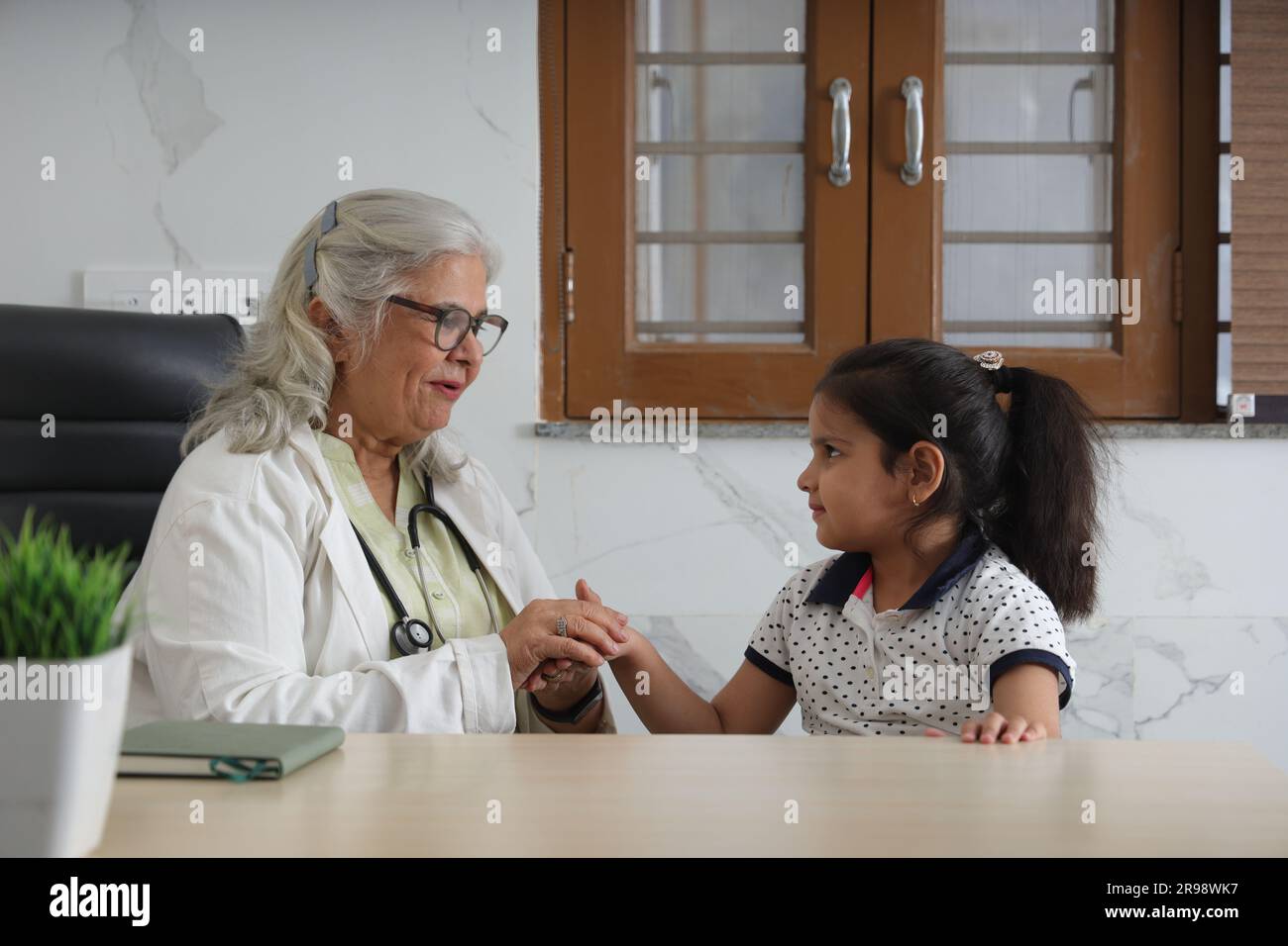 happy family visiting doctor for personal consultation with their ...