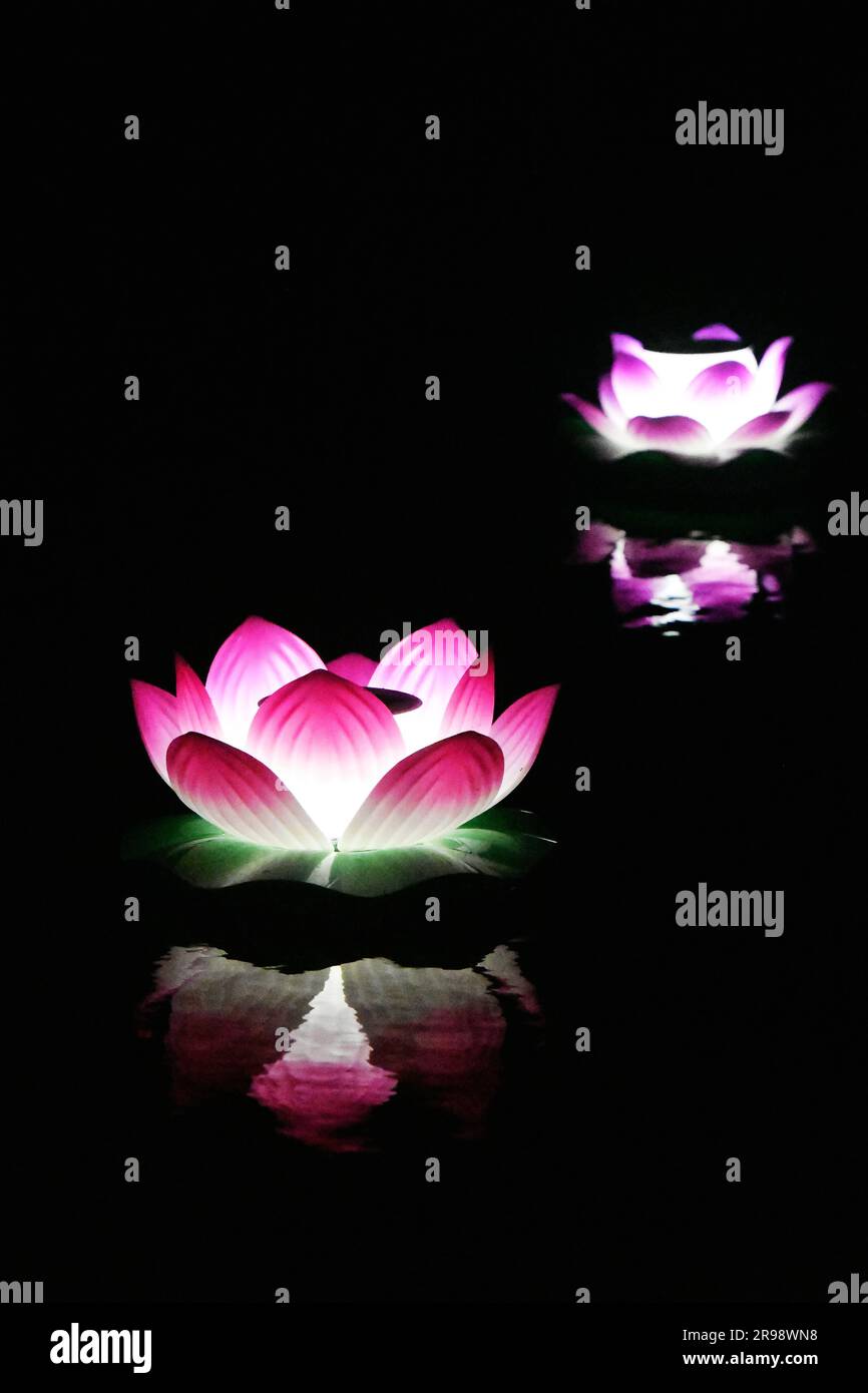 QINGDAO, CHINA - JUNE 24, 2023 - River lanterns float on the water of ...