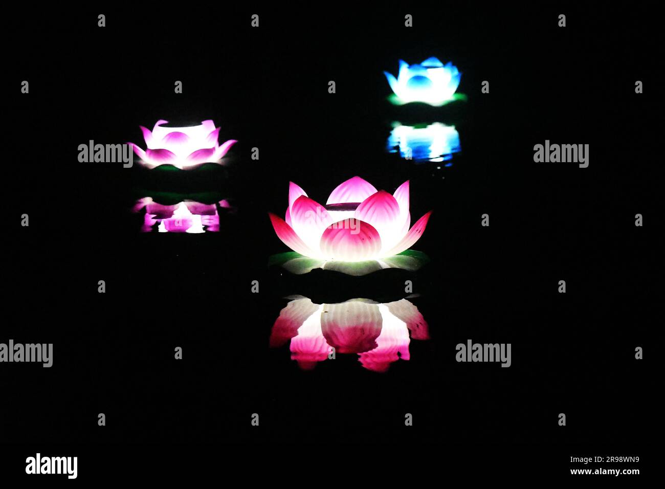 QINGDAO, CHINA - JUNE 24, 2023 - River lanterns float on the water of ...