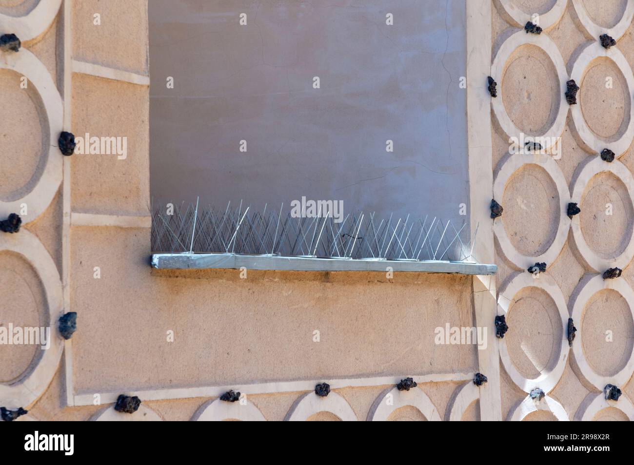 metal spikes placed in the window to prevent birds from roosting and ...