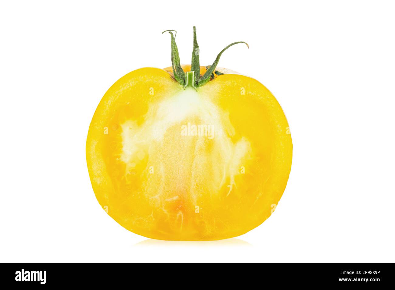 Half a fresh yellow tomato. Isolated on white background. File contains ...