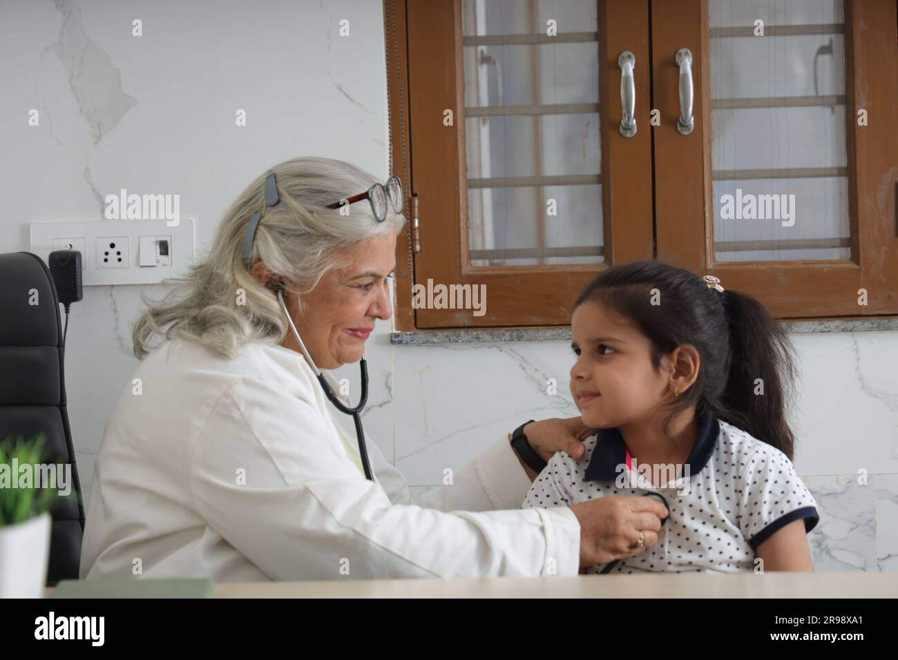 happy family visiting doctor for personal consultation with their ...