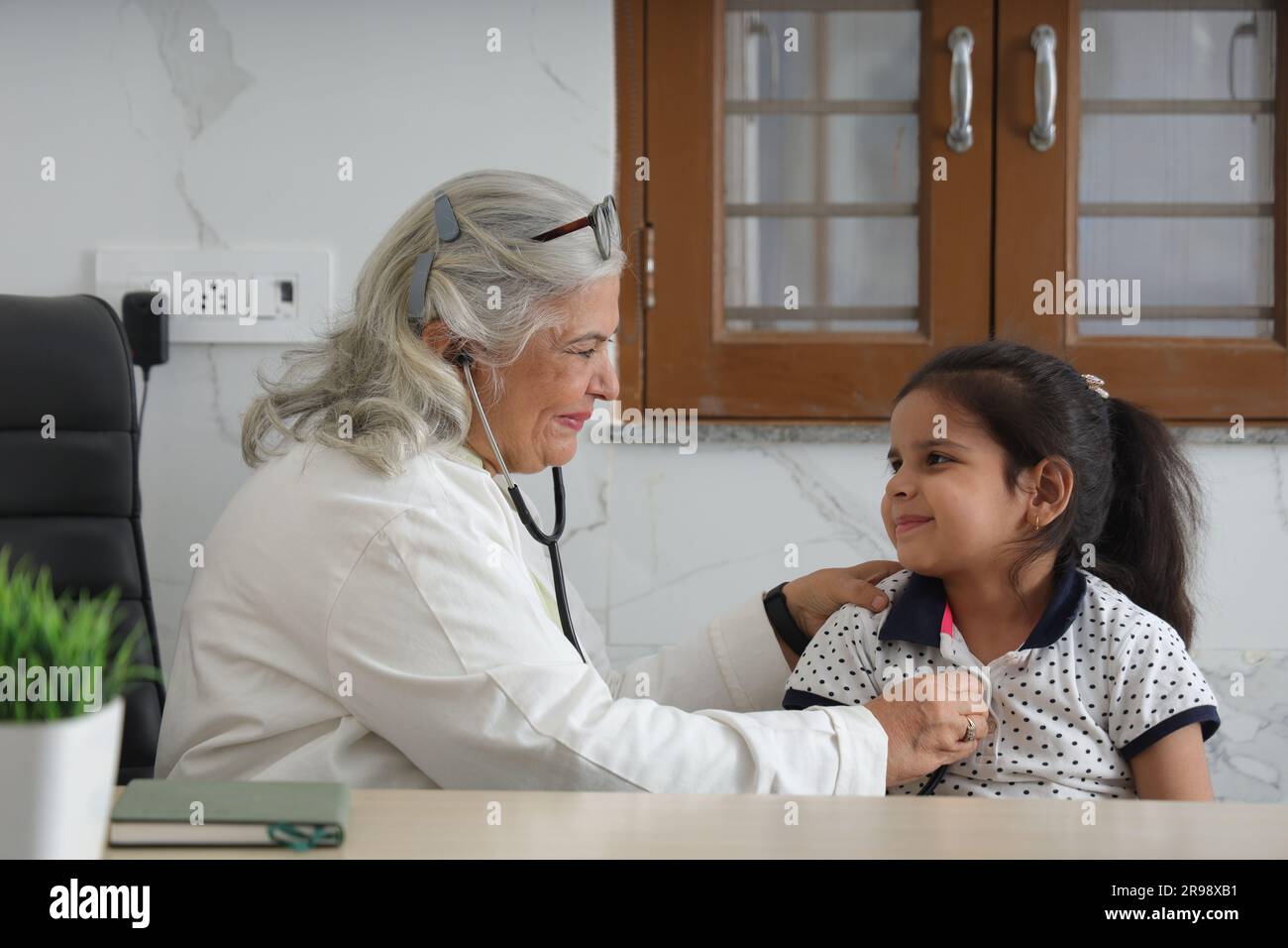 happy family visiting doctor for personal consultation with their ...