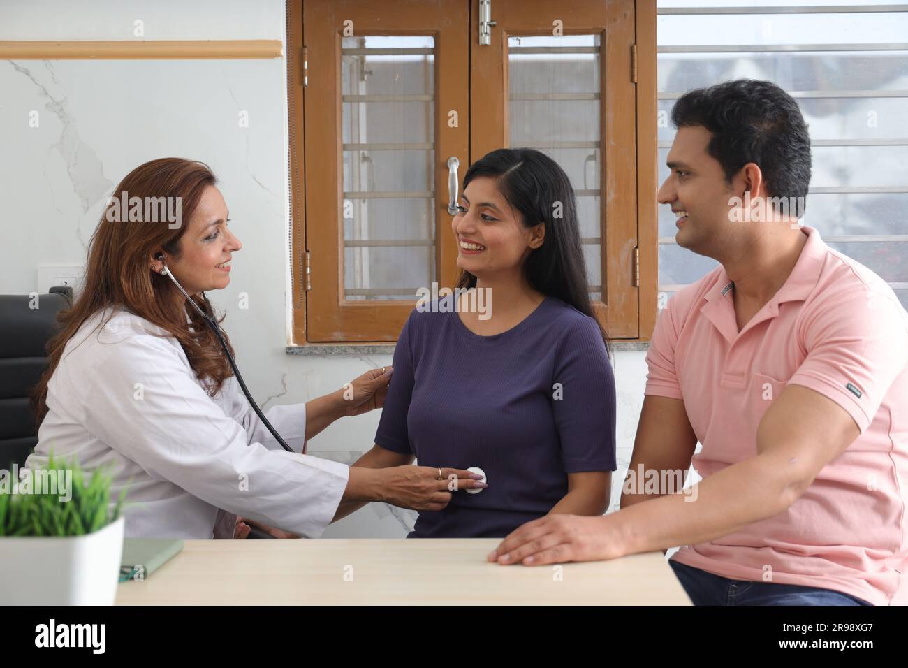 mother is expecting baby. Young woman patient with husband getting ...