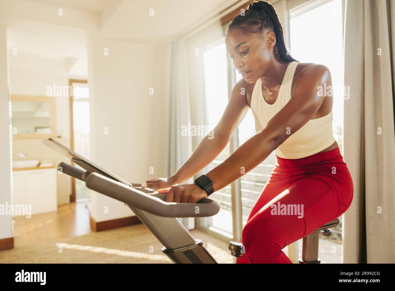 Fit and healthy African woman maintains her active lifestyle by ...