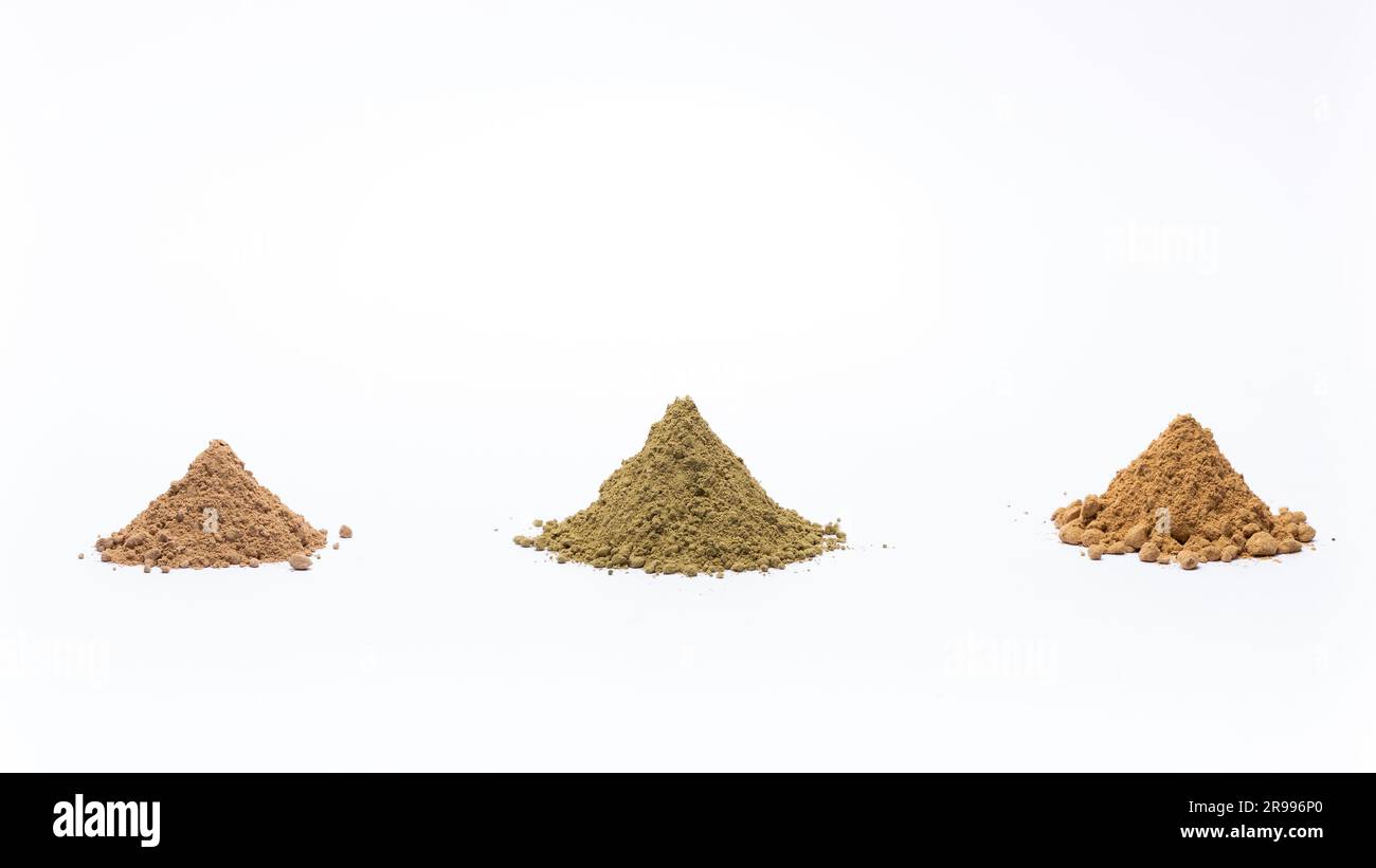 The three piles of different powders isolated on a white background ...