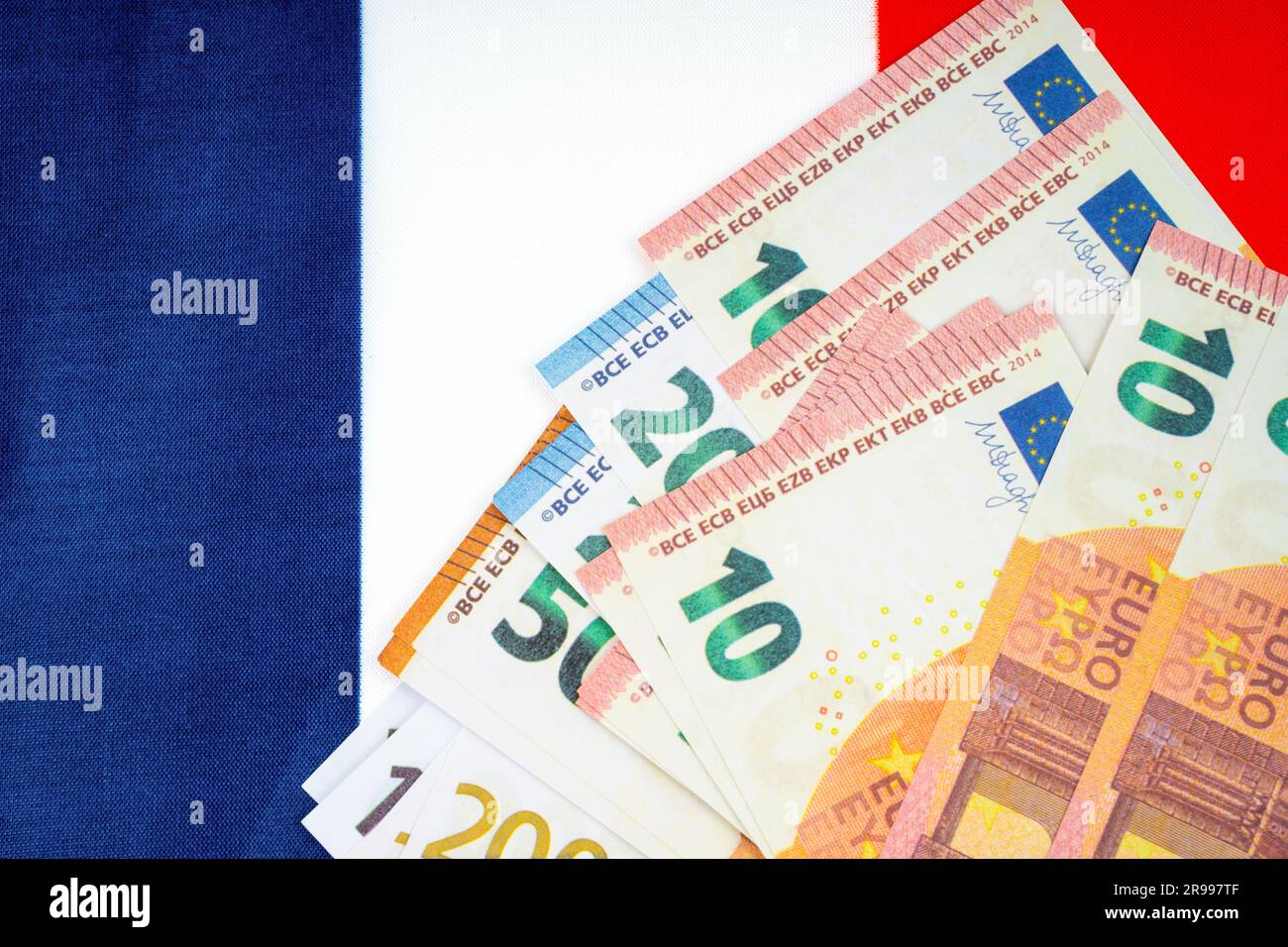 Euro banknote on France flag Stock Photo - Alamy