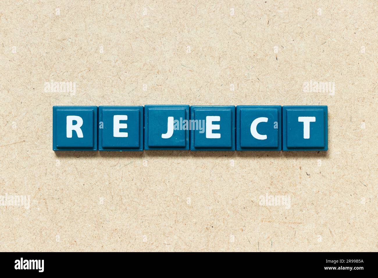 Tile alphabet letter in word reject on wood background Stock Photo - Alamy