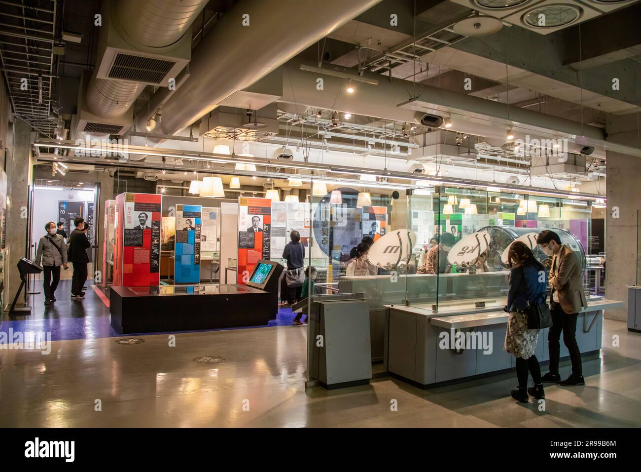 the toursit are visiting exhibition "Exploring the Structure of Nature ...
