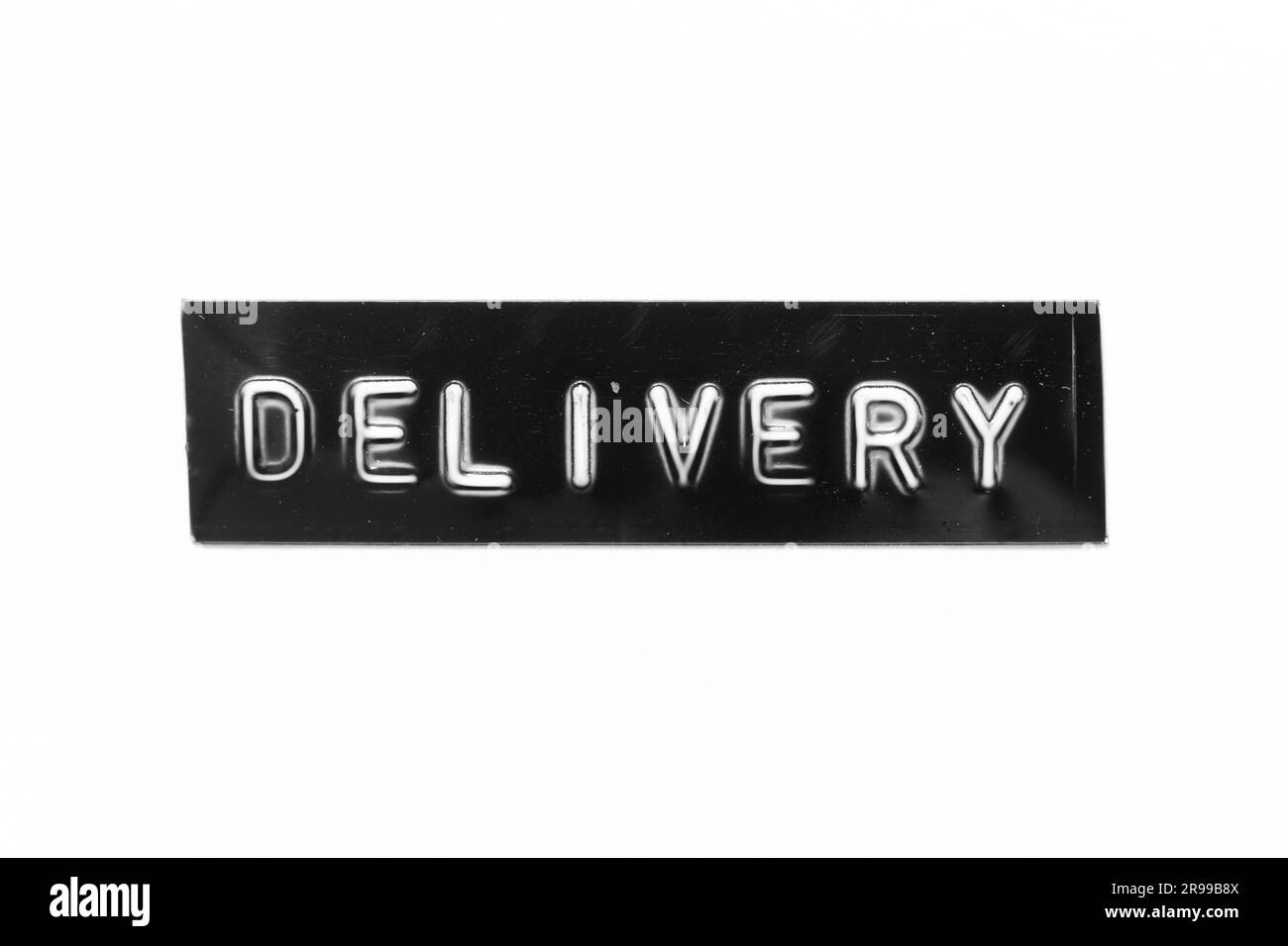 Black color banner that have embossed letter with word delivery on ...
