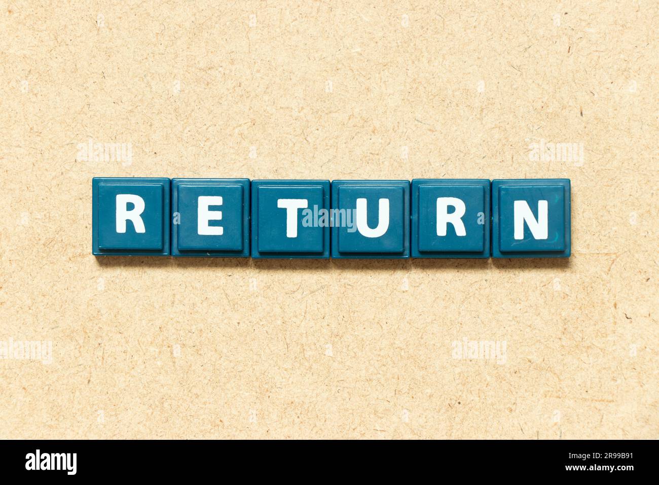 Tile alphabet letter in word return on wood background Stock Photo - Alamy