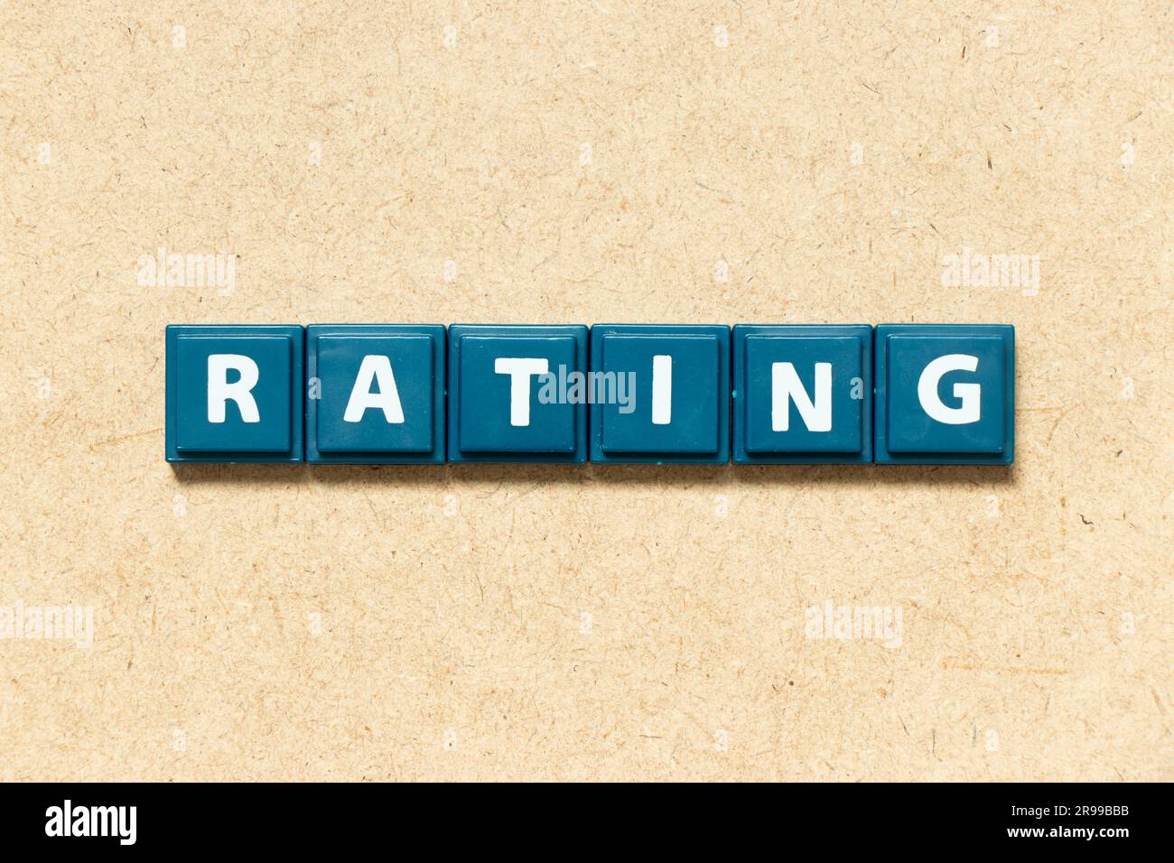 Tile alphabet letter in word rating on wood background Stock Photo - Alamy