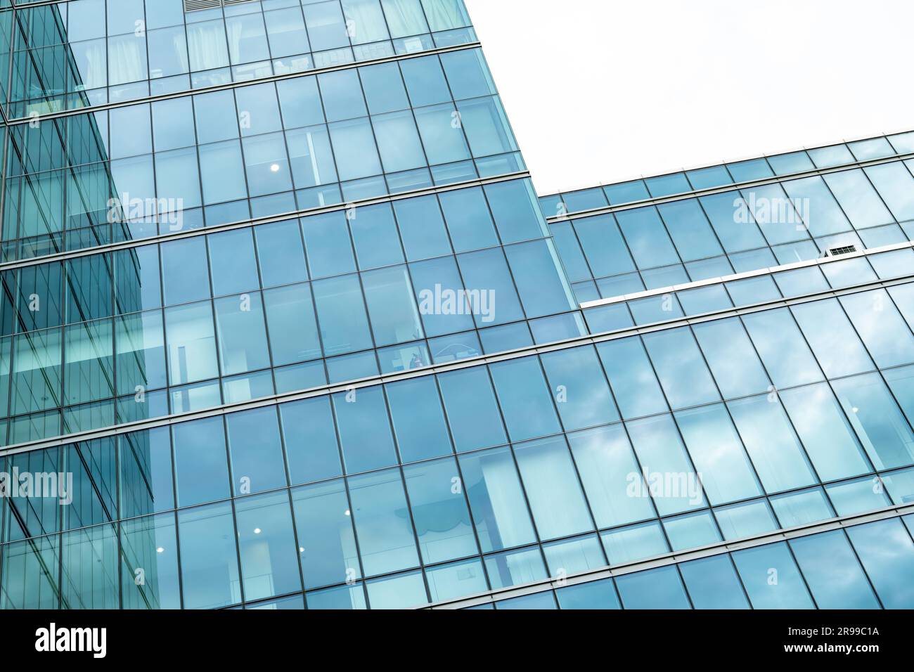 Modern sustainable glass office building. Exterior view of corporate ...