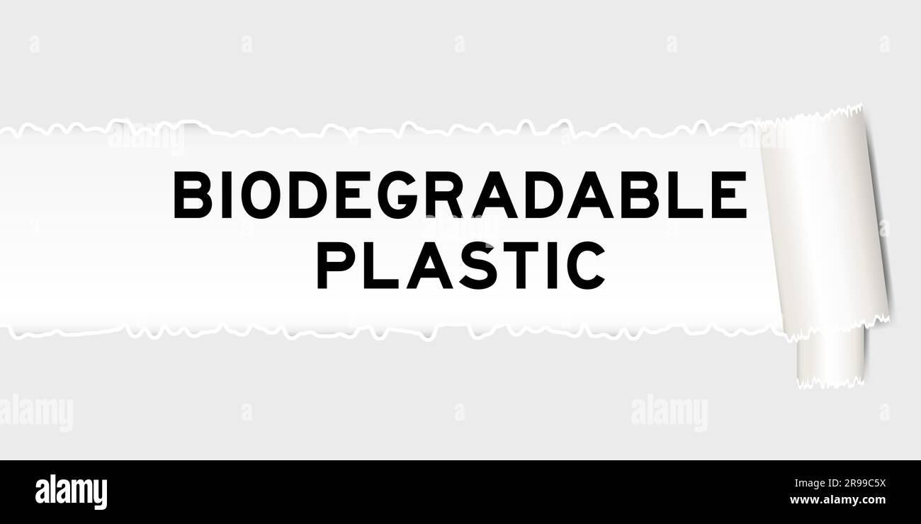 Ripped gray paper background that have word biodegradable plastic under ...