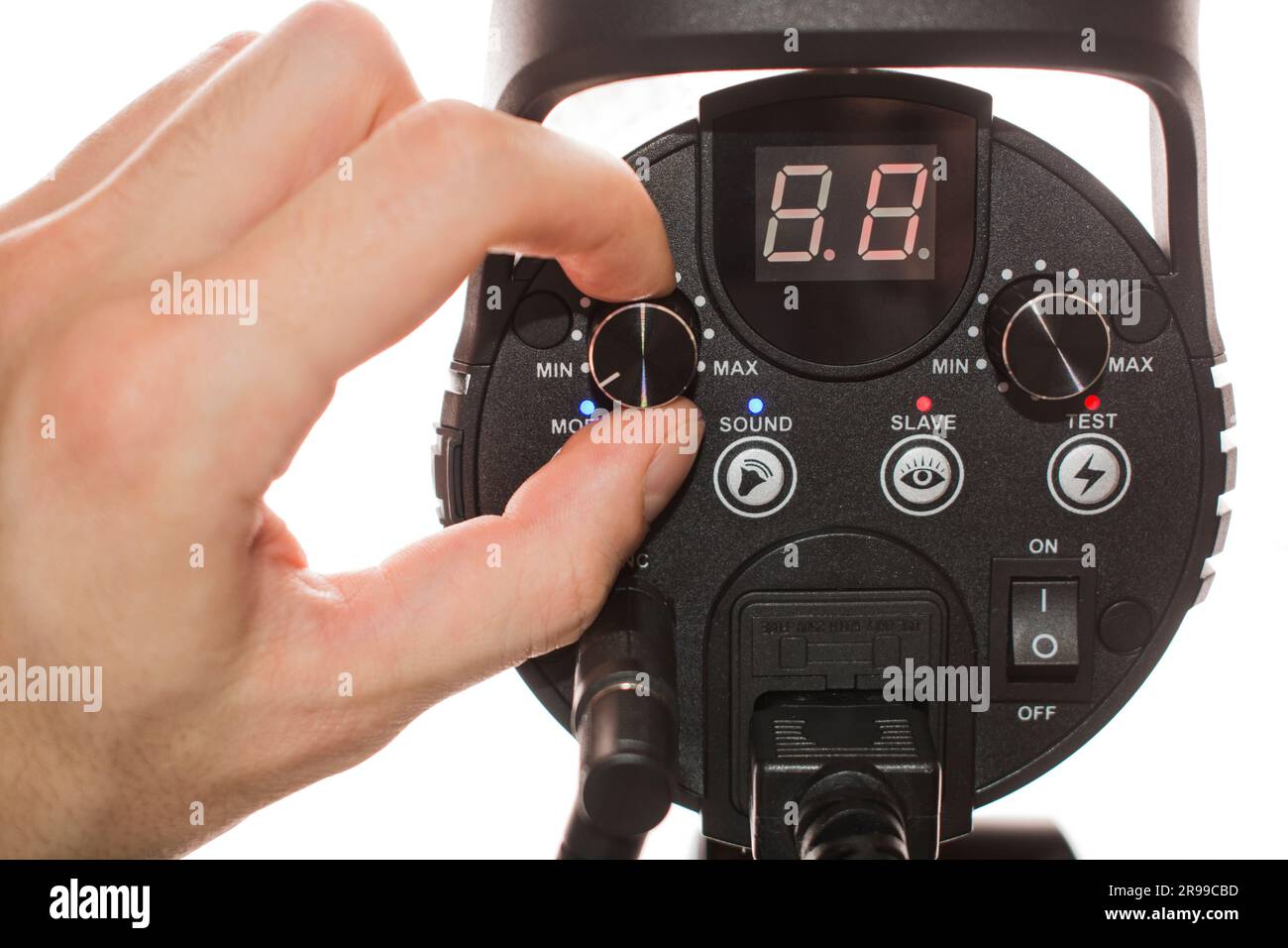 hand holding a flash, isolated on a white background adjustable with a ...