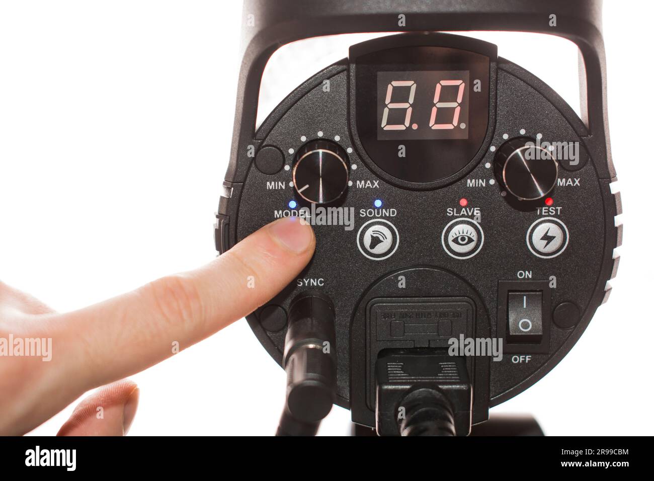 hand holding a flash, isolated on a white background adjustable with a ...