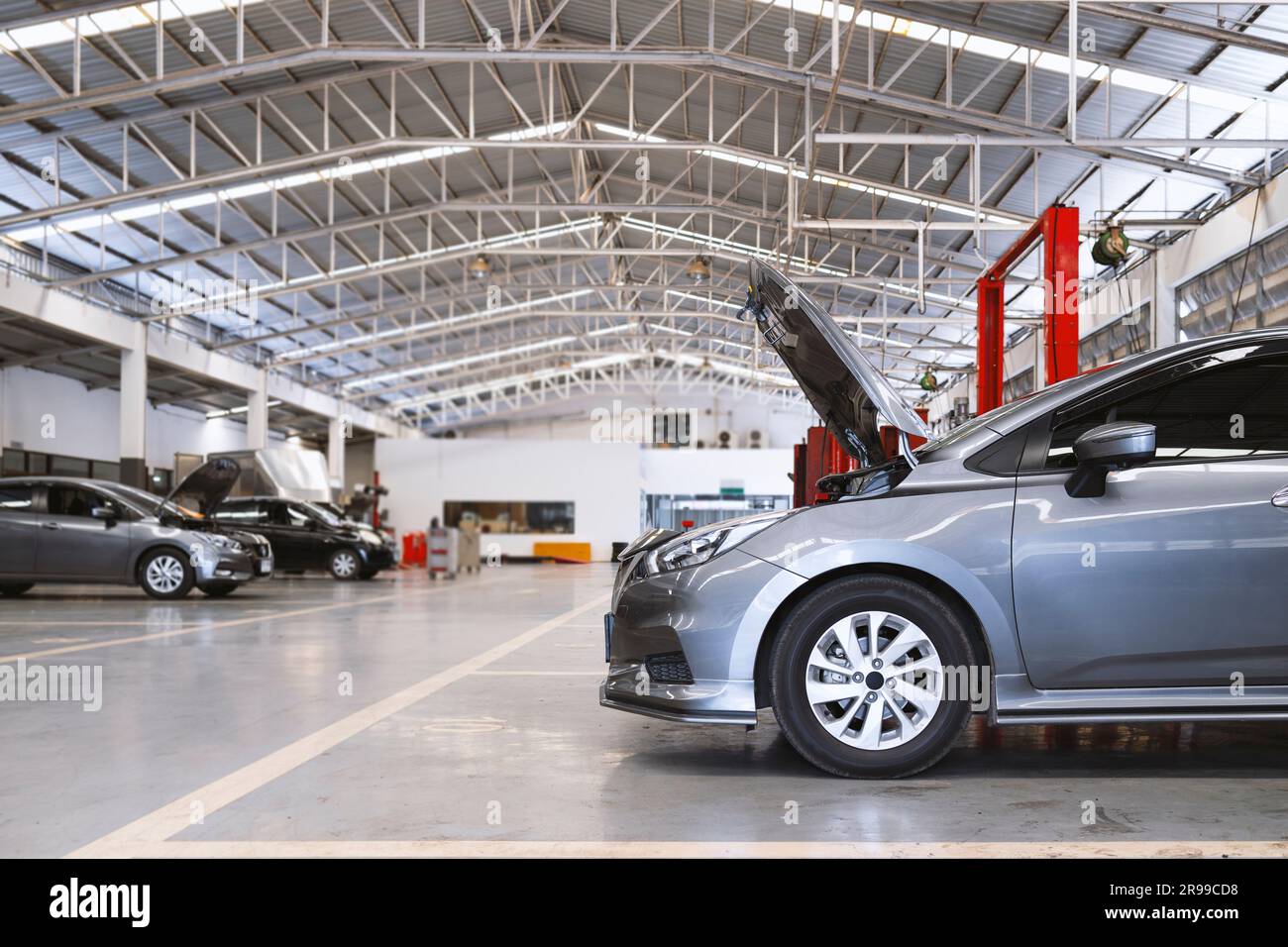 car in automobile repair service center with soft-focus and over light ...