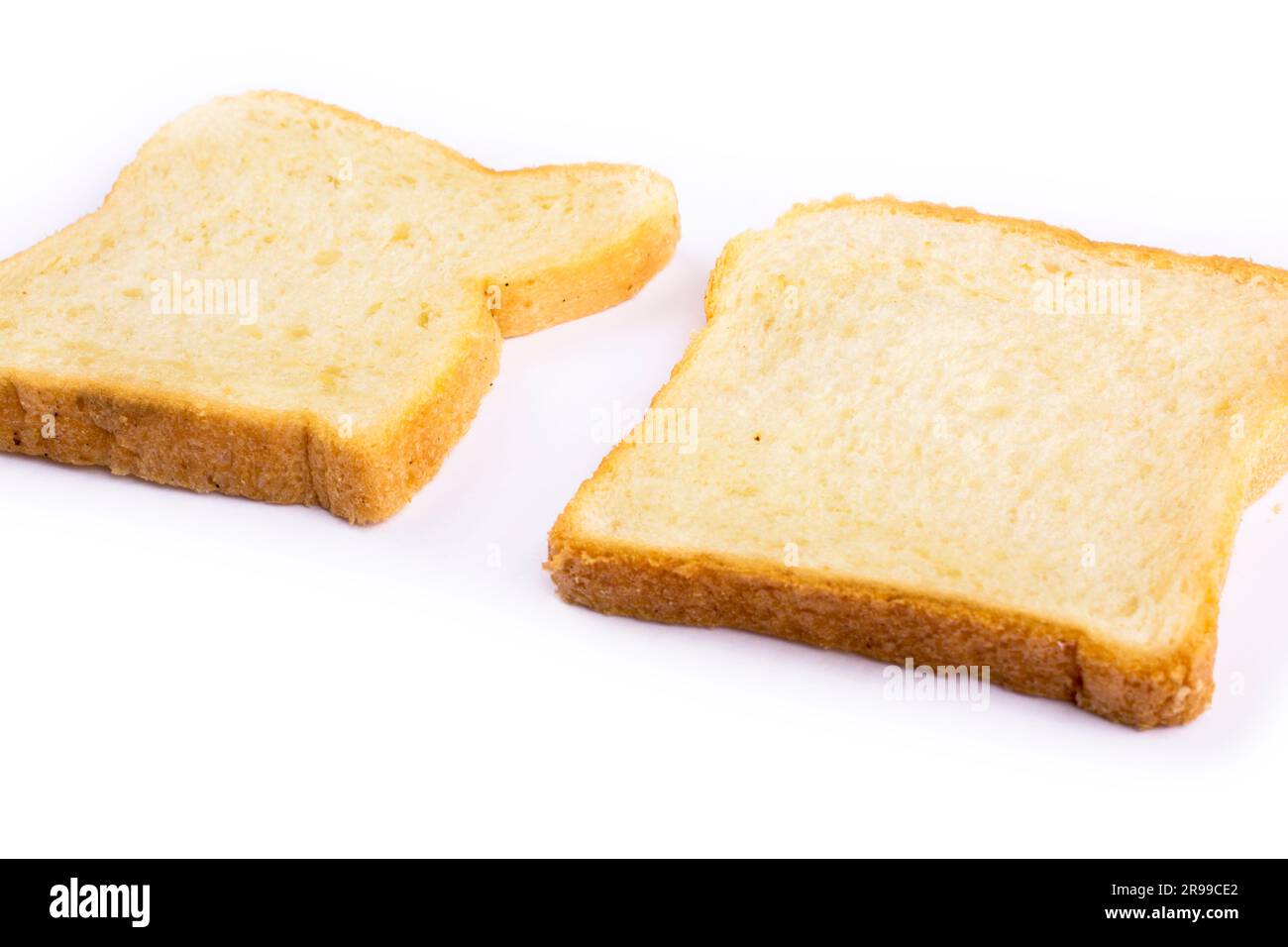 two slices of bread for toast on a white background Stock Photo - Alamy