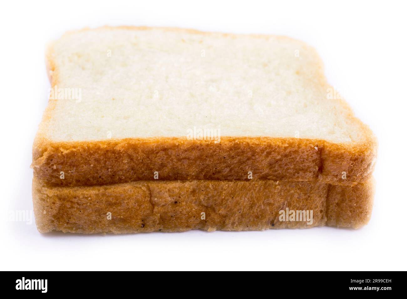 two slices of bread for toast on a white background Stock Photo - Alamy