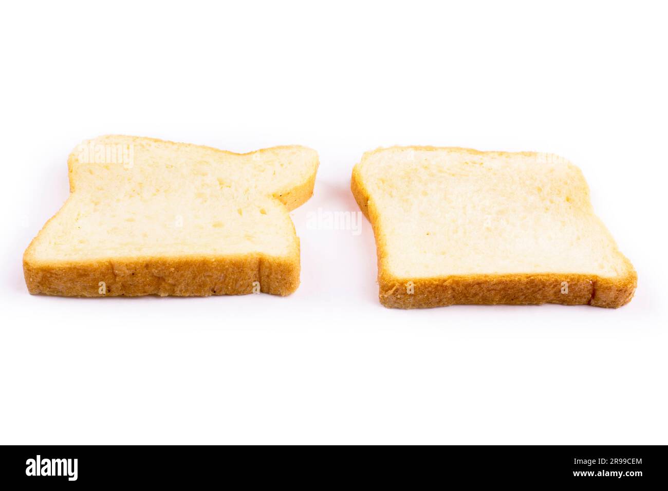 two slices of bread for toast on a white background Stock Photo - Alamy
