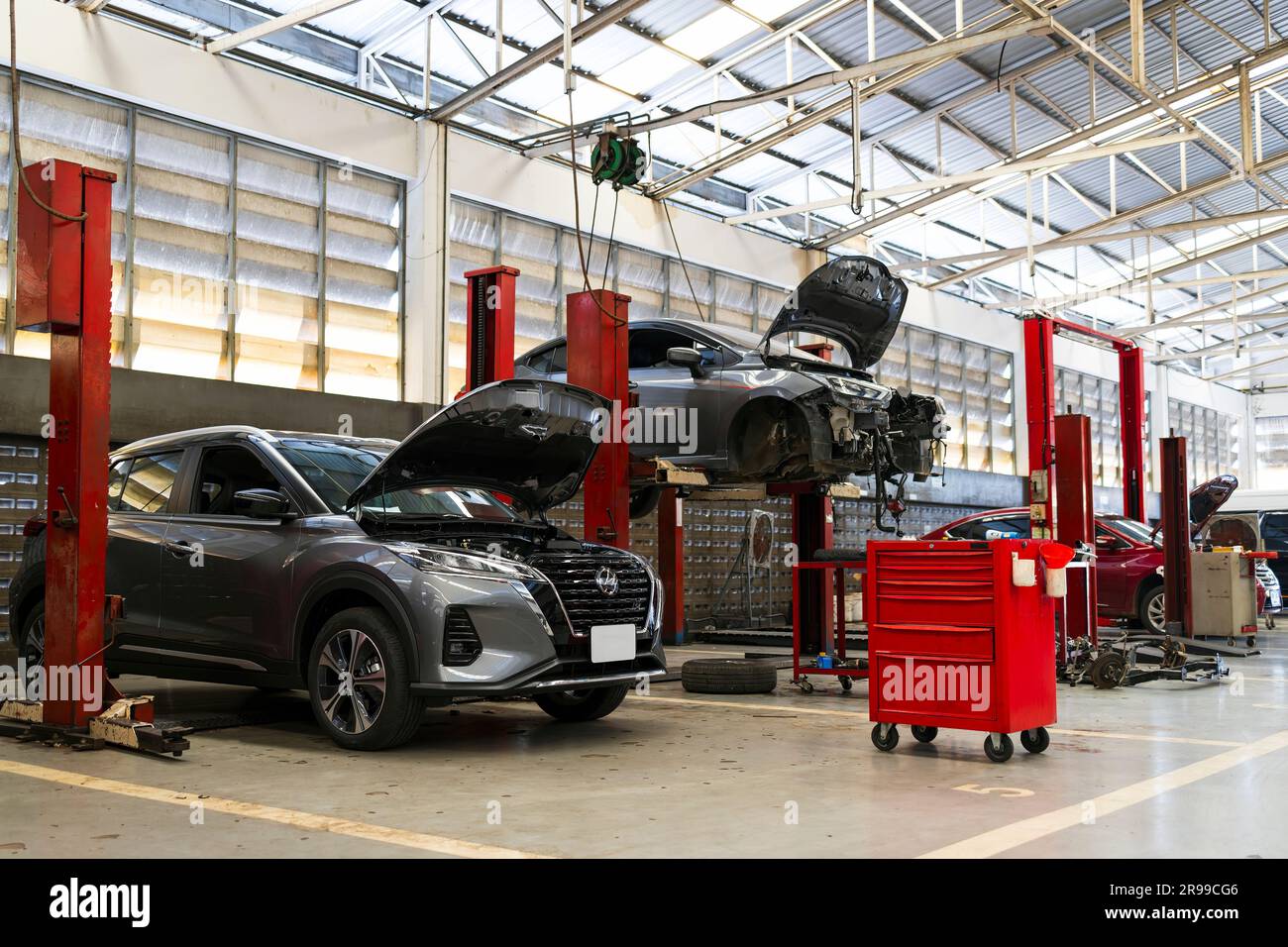 car in automobile repair service center with soft-focus and over light ...