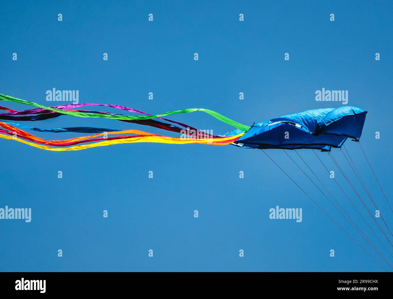 A large kite in a clear blue sky Stock Photo - Alamy