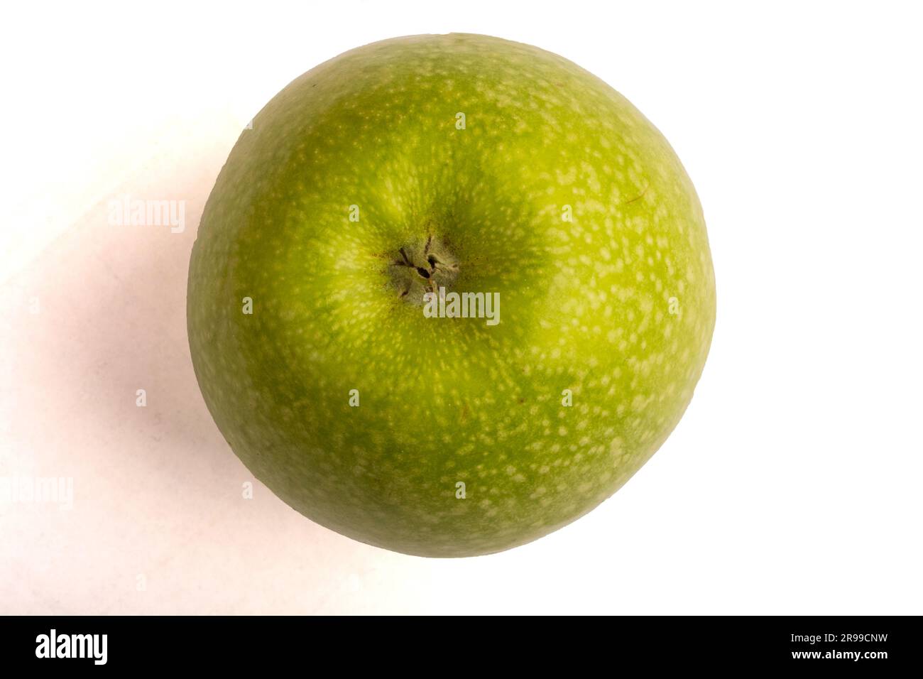 green apple with fading from above, isolated on white background Stock ...
