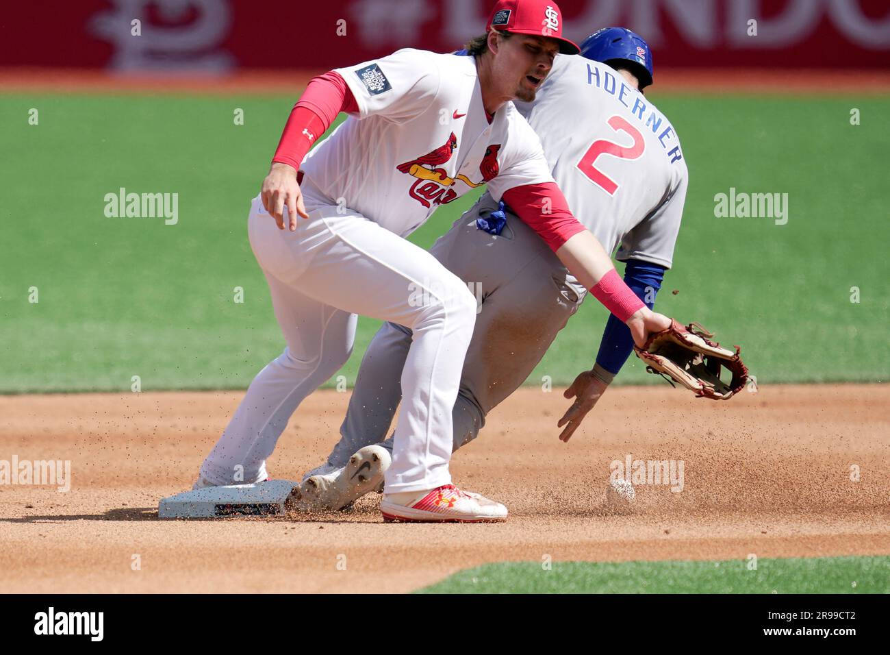 Chicago Cubs' Nico Hoerner (2), right, steals second base next to St. Louis Cardinals second ...