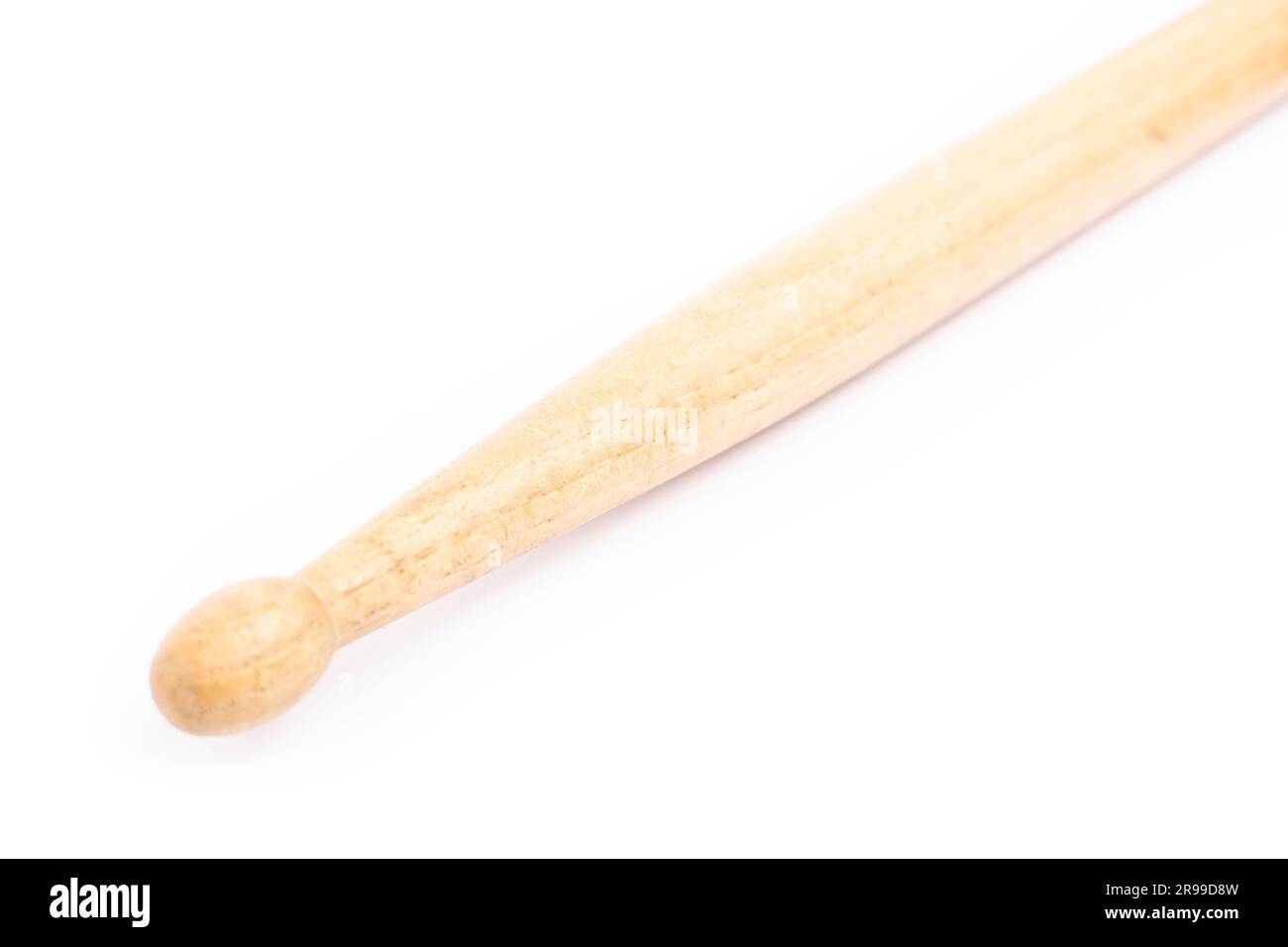 one wooden drumstick on a white background isolate Stock Photo - Alamy