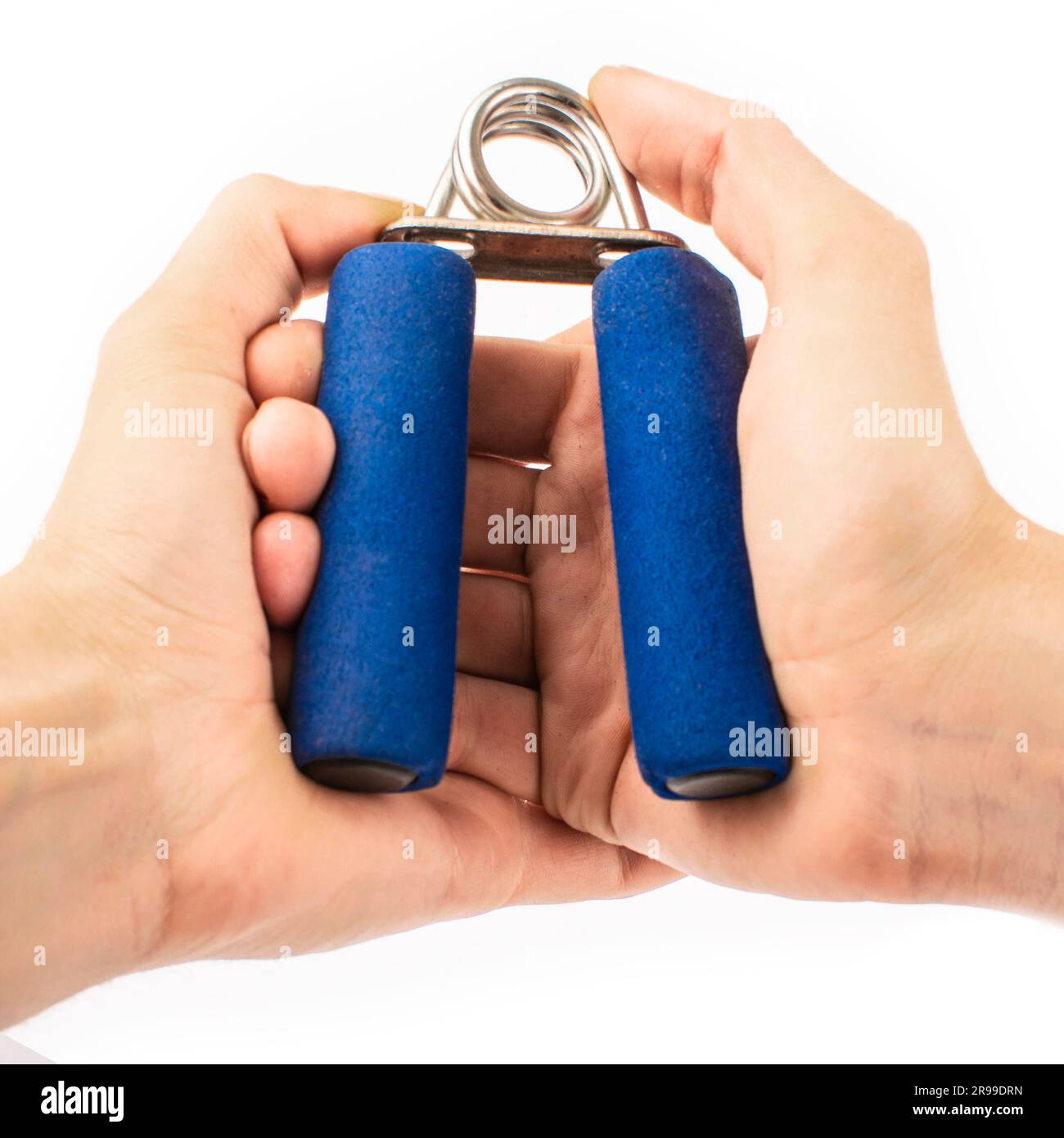 arm with hand expander isolated on white background Stock Photo - Alamy