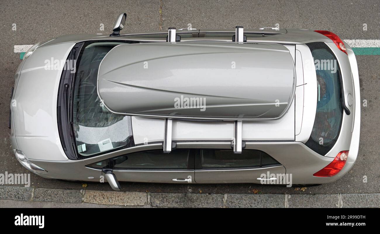 Big and long cargo top box at silver car roof Stock Photo - Alamy