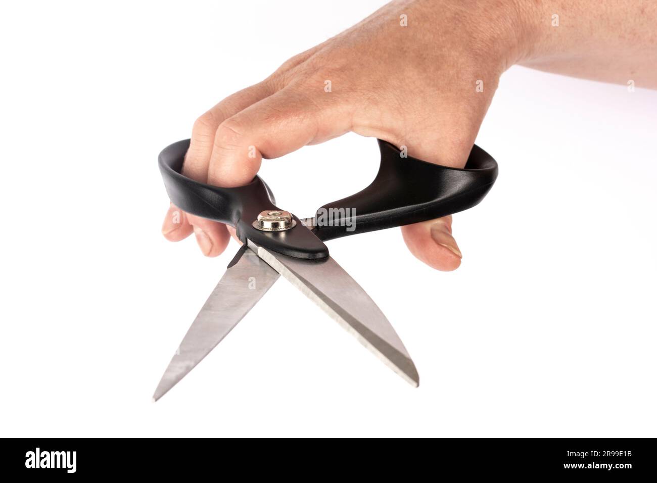hand with black scissors in white background isolate Stock Photo - Alamy